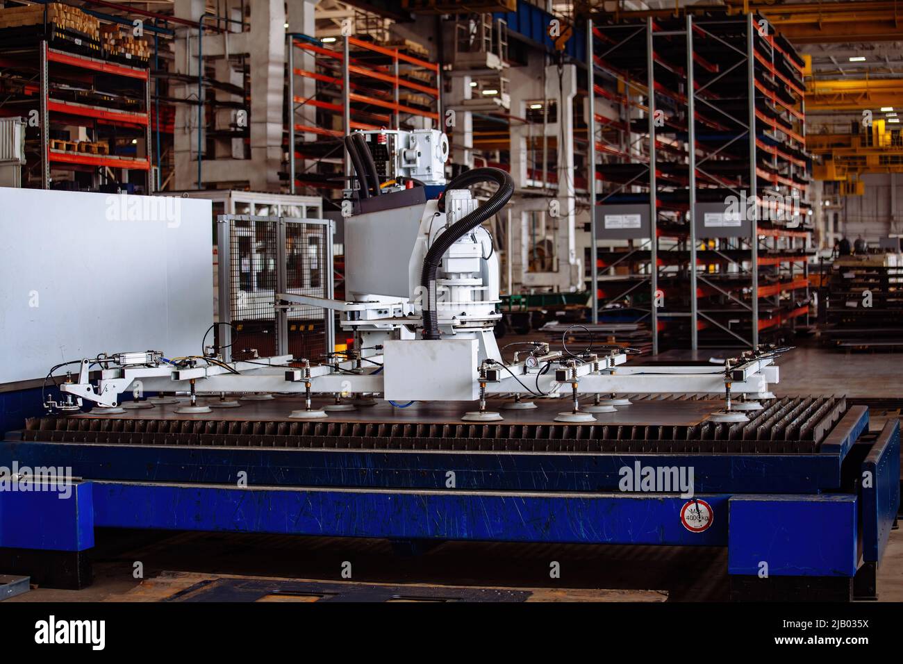 Loading unit of cutting machine. Mechanical vacuum lifter loading metal ...