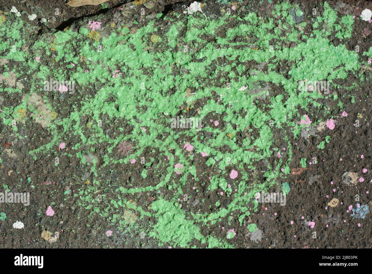 Green, Pink and white Paint drops on the ground. Costruction paint ...