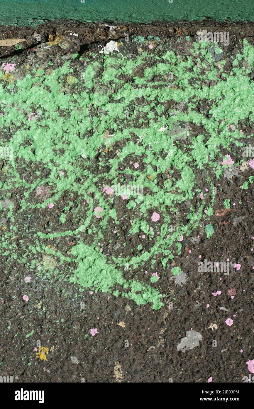 Green, Pink and white Paint drops on the ground. Costruction paint ...