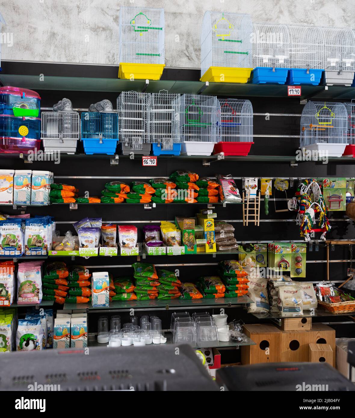 Modern comfortable different variation of goods for animals in pet shop ...