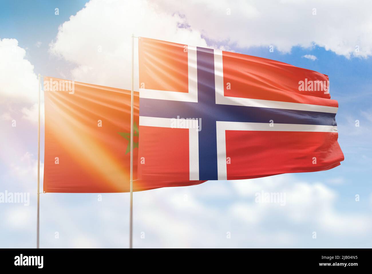 Sunny blue sky and flags of norway and morocco Stock Photo - Alamy