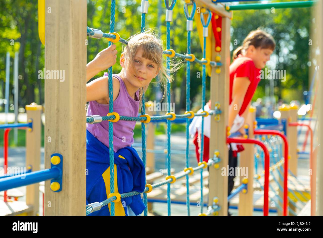 Happy girls playing outdoors Stock Photo - Alamy