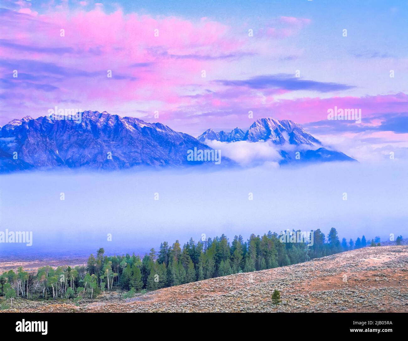 sunrise over valley fog and peaks in grand teton national park, wyoming ...