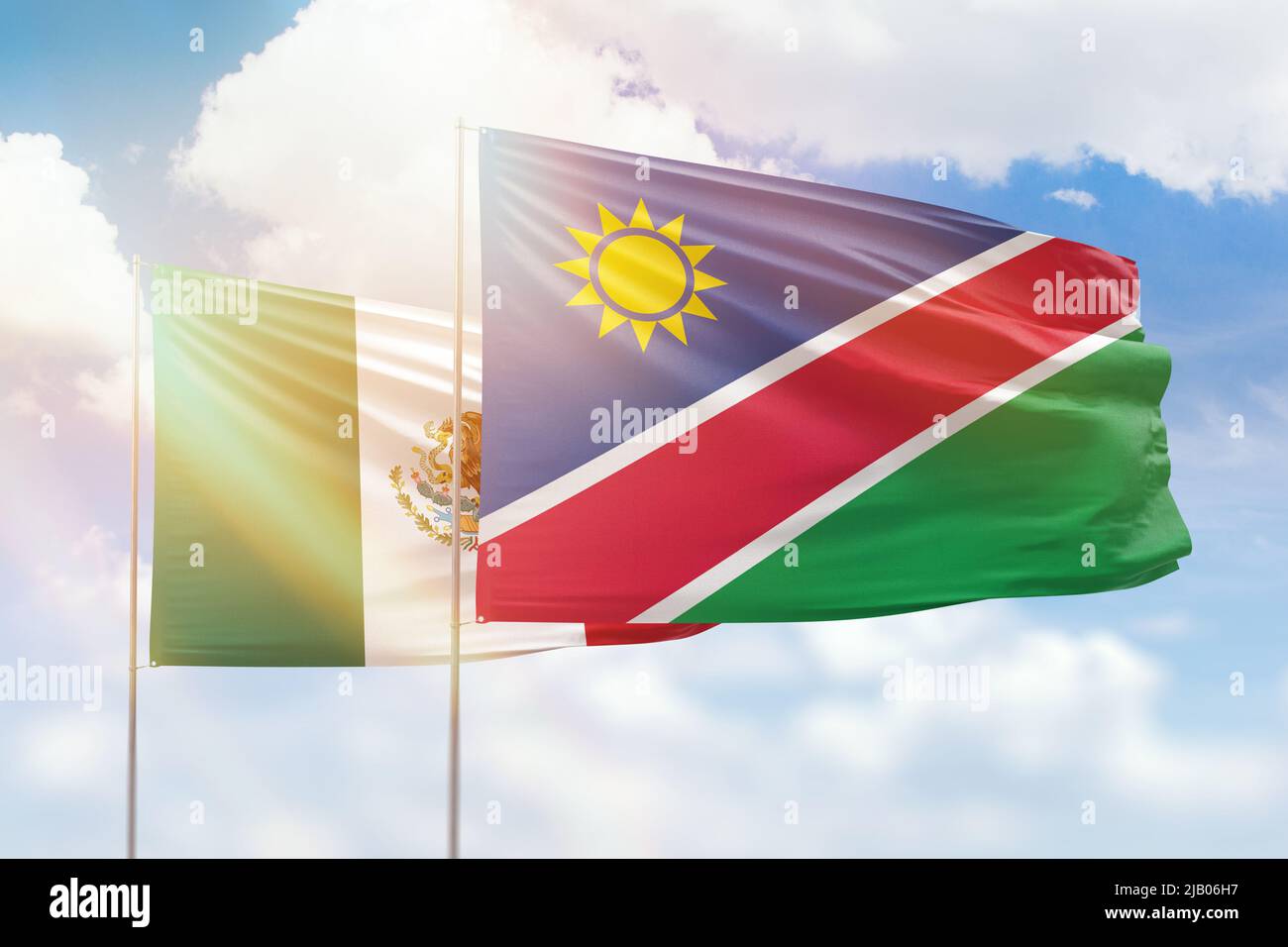 Sunny blue sky and flags of namibia and mexico Stock Photo - Alamy