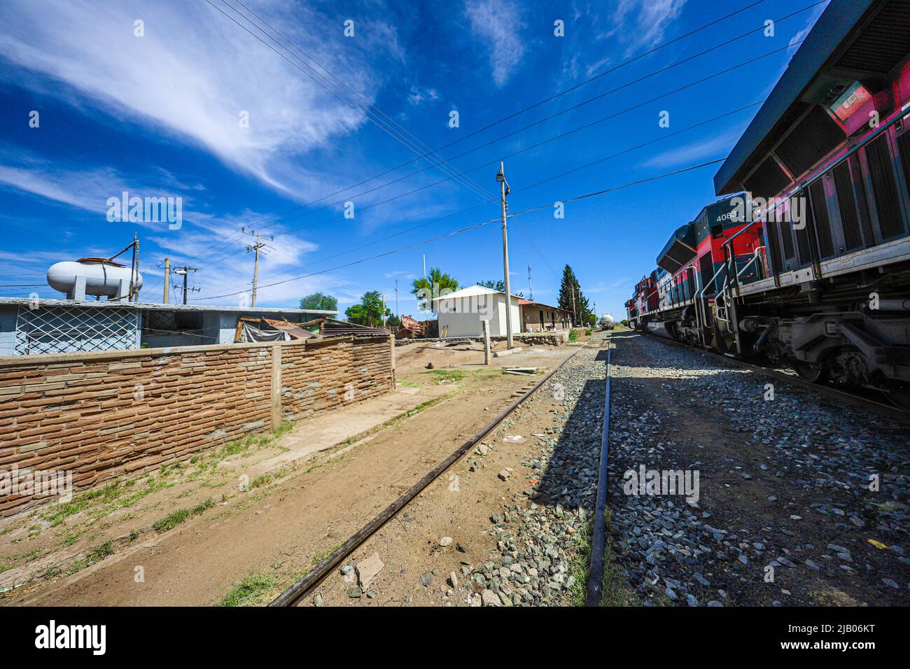 Train on the tracks in the town of Esqueda, Mexico. Pueblo Esqueda in ...