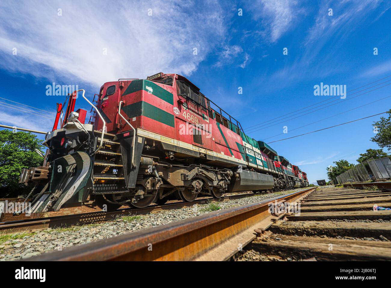 Train on the tracks in the town of Esqueda, Mexico. Pueblo Esqueda in ...
