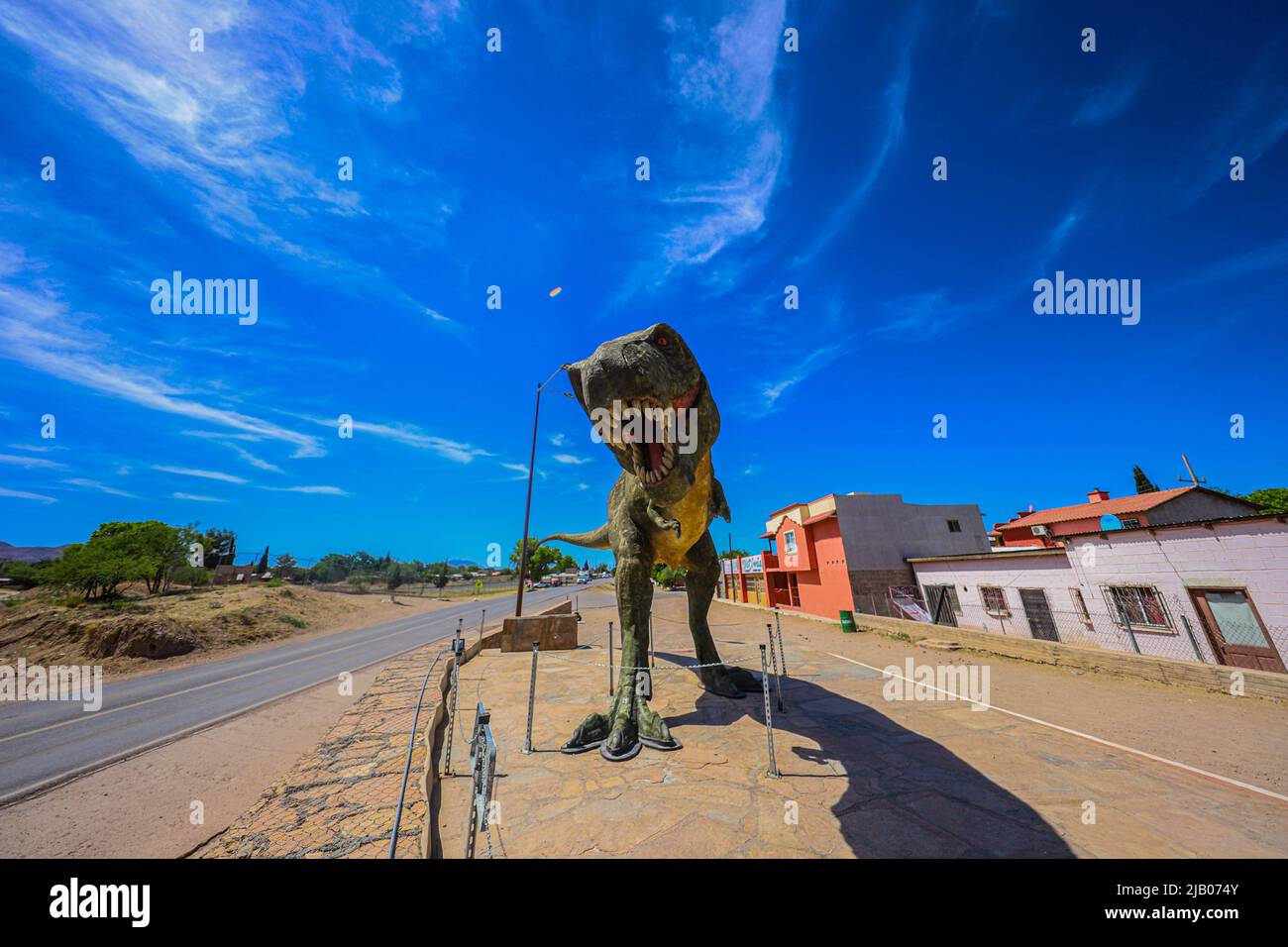 A Tyrannosaurus rex dinosaur sculpture in Esqueda, Mexico. Pueblo ...