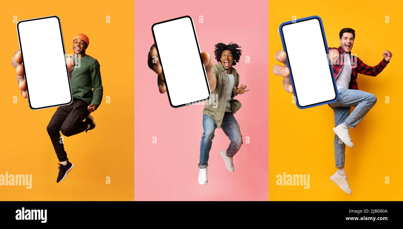 Three happy multiracial millennial guys showing smartphones with empty ...