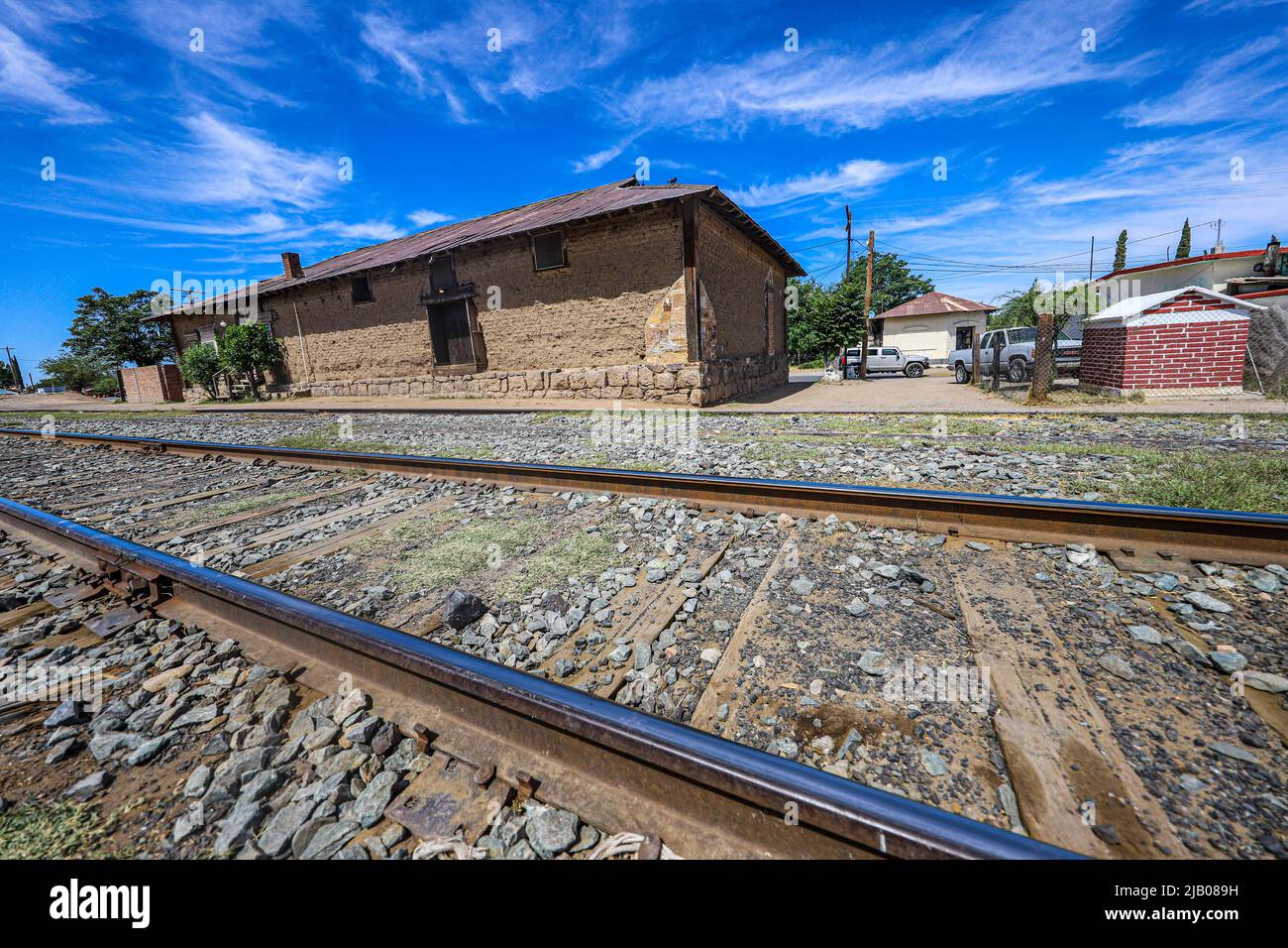 Train tracks, railway and old adobe train station in Esqueda, Mexico ...