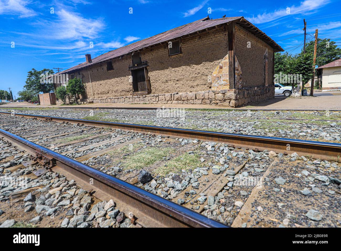 Train tracks, railway and old adobe train station in Esqueda, Mexico ...