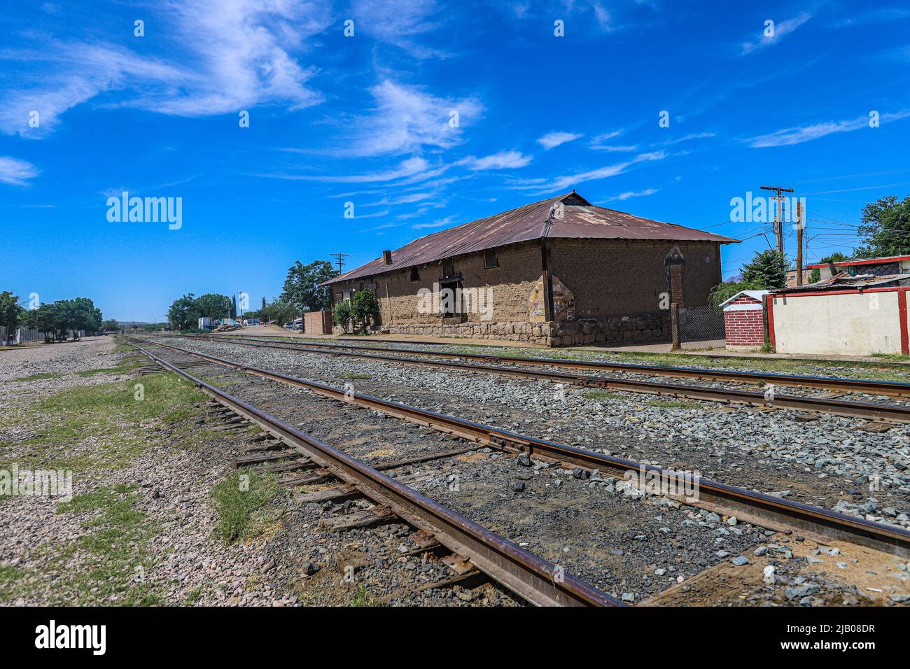 Train tracks, railway and old adobe train station in Esqueda, Mexico ...