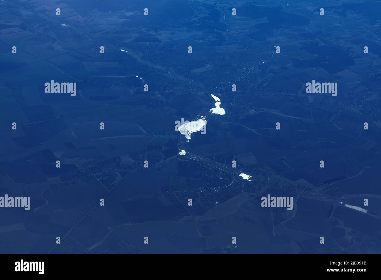 Aerial view of blue terrain . Navigation over the Earth Stock Photo - Alamy