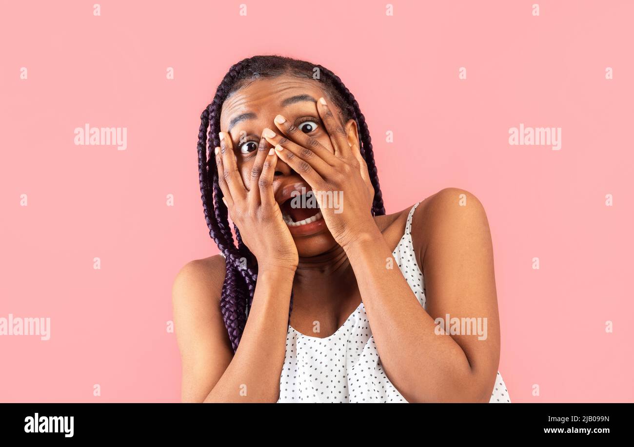 Fear fingers face afraid hi-res stock photography and images - Alamy