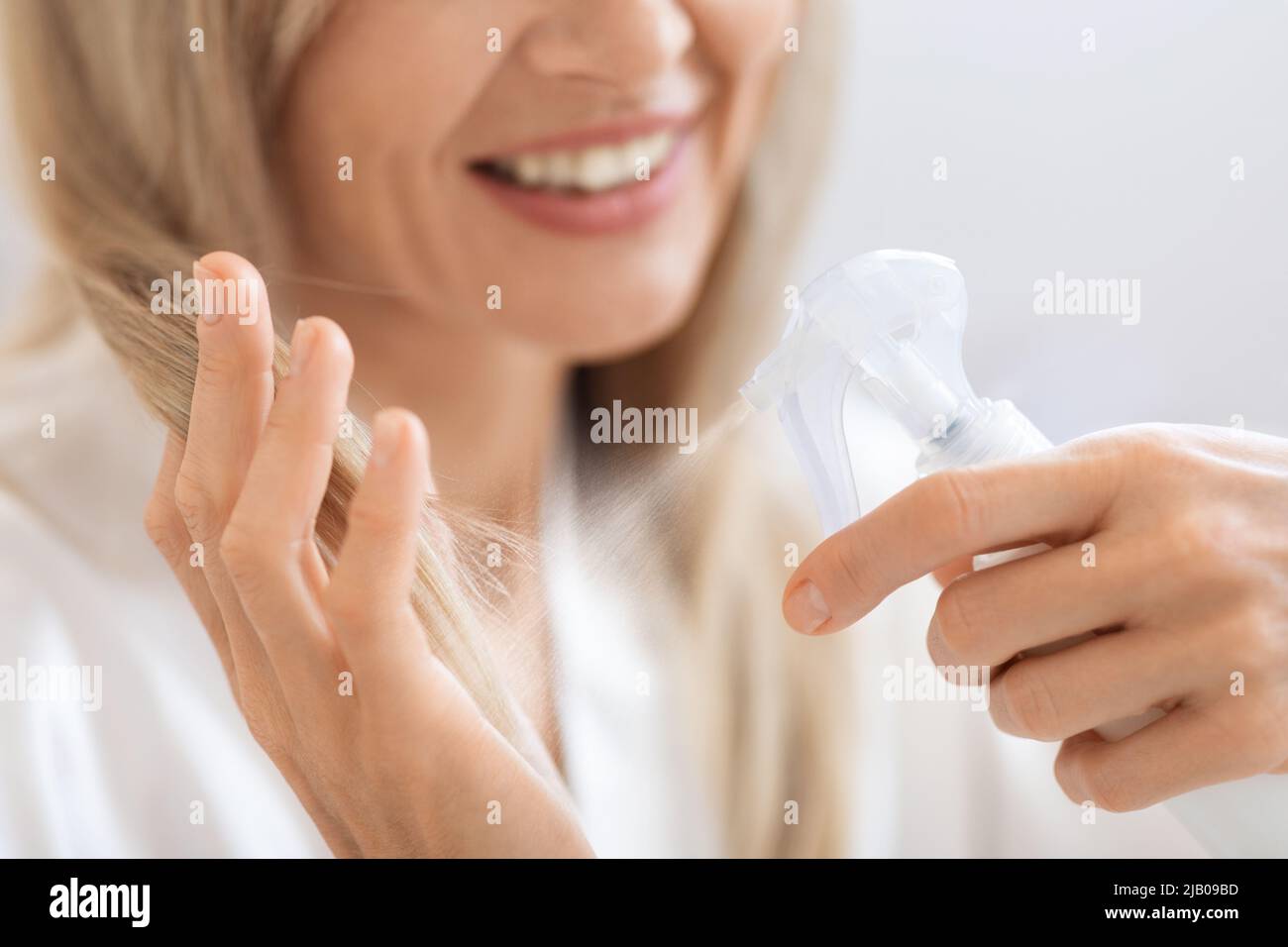 Using hair spray hi-res stock photography and images - Alamy
