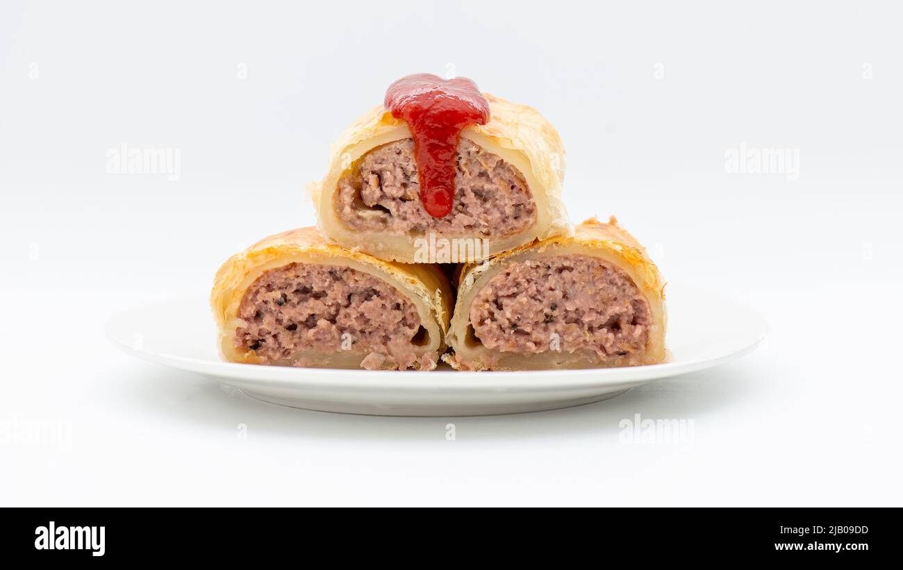 Fresh baked golden flaky beef sausage roll Stock Photo - Alamy