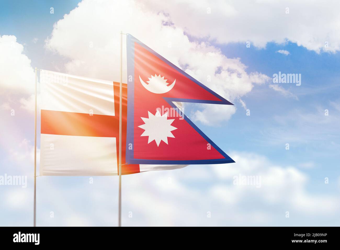 Sunny blue sky and flags of nepal and england Stock Photo - Alamy