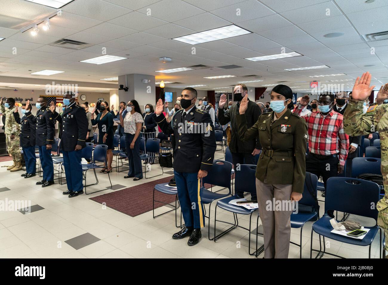 People take an Oath during Memorial Day naturalization ceremony at ...