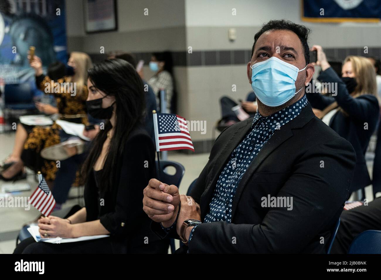 New York, NY - June 1, 2022: A man holds an American flag during ...