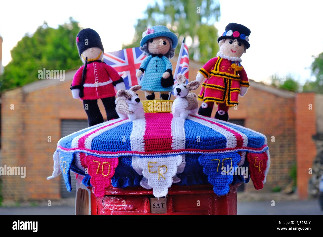 London, UK. 1st June, 2022. A Jubilee-themed crocheted postbox topper ...