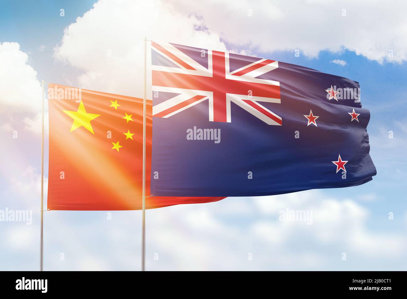 Sunny blue sky and flags of new zealand and china Stock Photo - Alamy