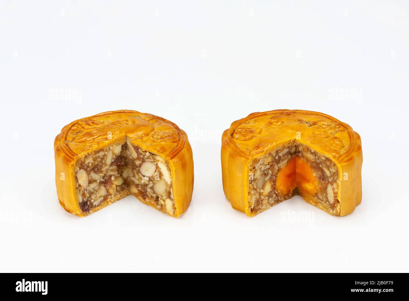 Wuren (Mixed Nuts) and Salted Egg Yolk filling Mooncake on white ...