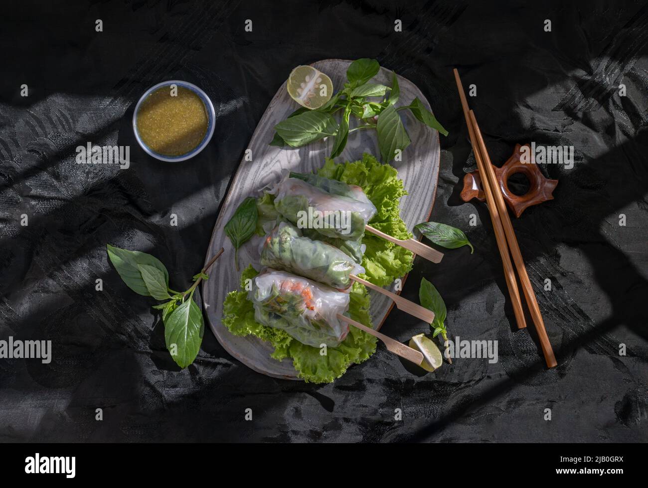 Healthy vietnamese spring rolls as portion stuff vegetable on ceramic ...