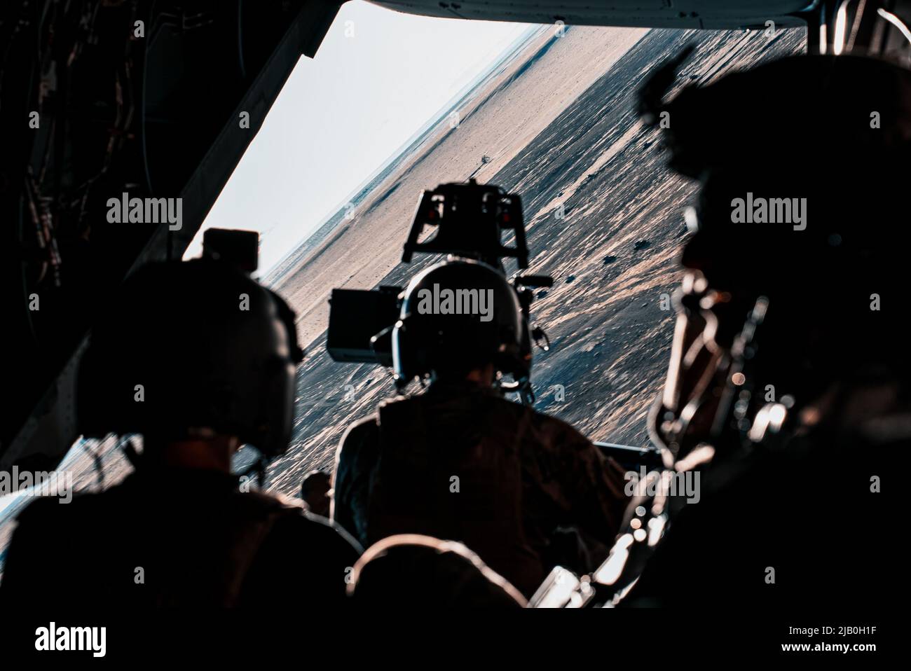 Sam Eckholm (left), multimedia content creator, sits on the ramp of a ...