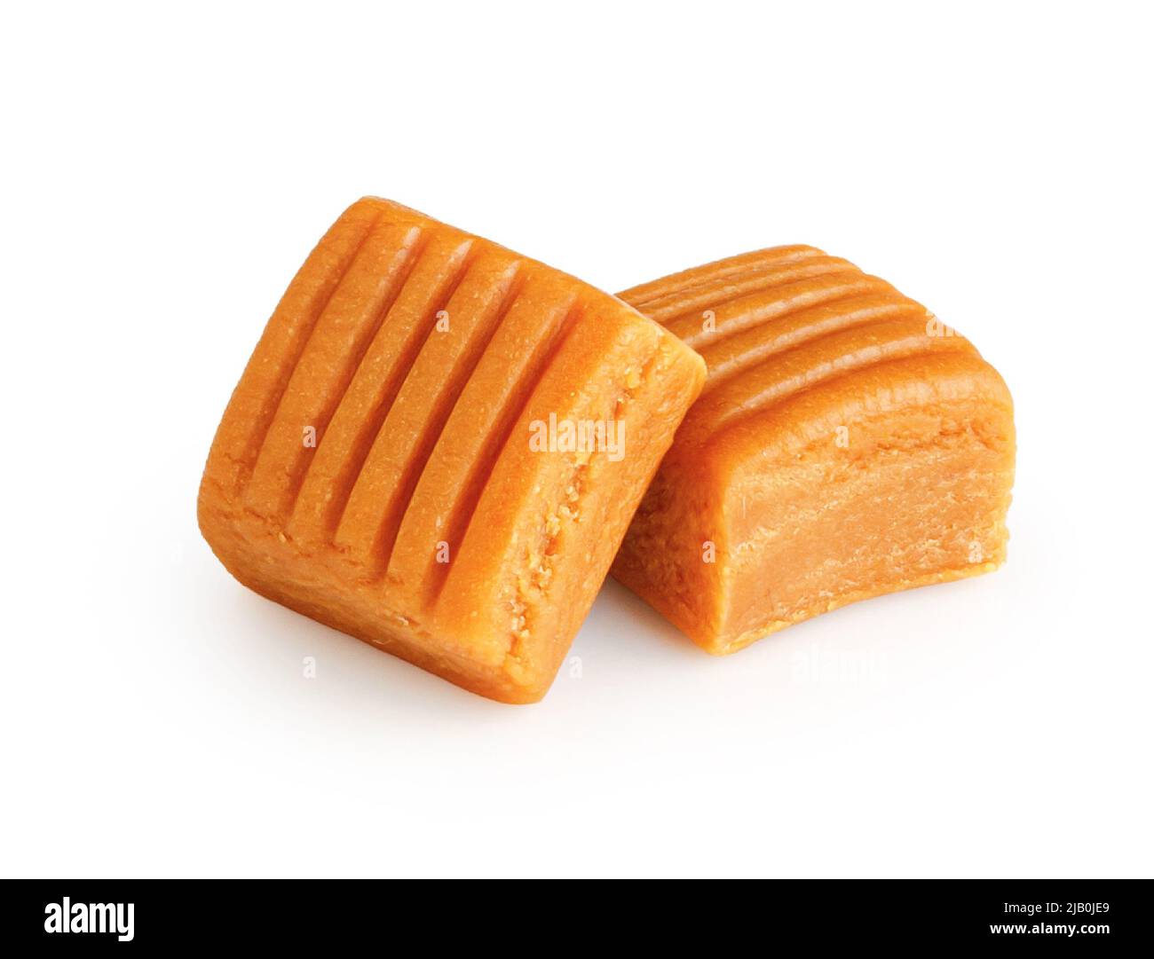 Caramel cubes with isolated on white background Stock Photo - Alamy