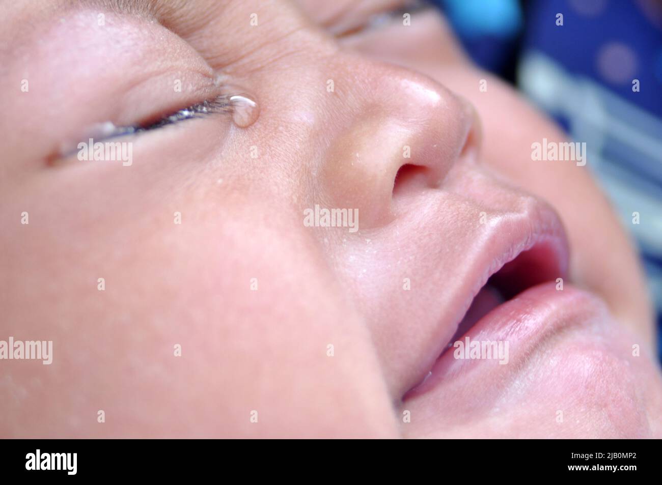 baby face sad crying close-up Stock Photo - Alamy