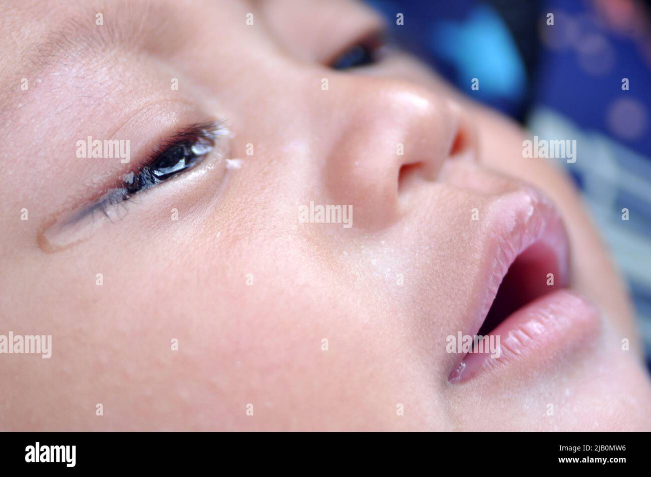 baby face sad crying close-up Stock Photo - Alamy