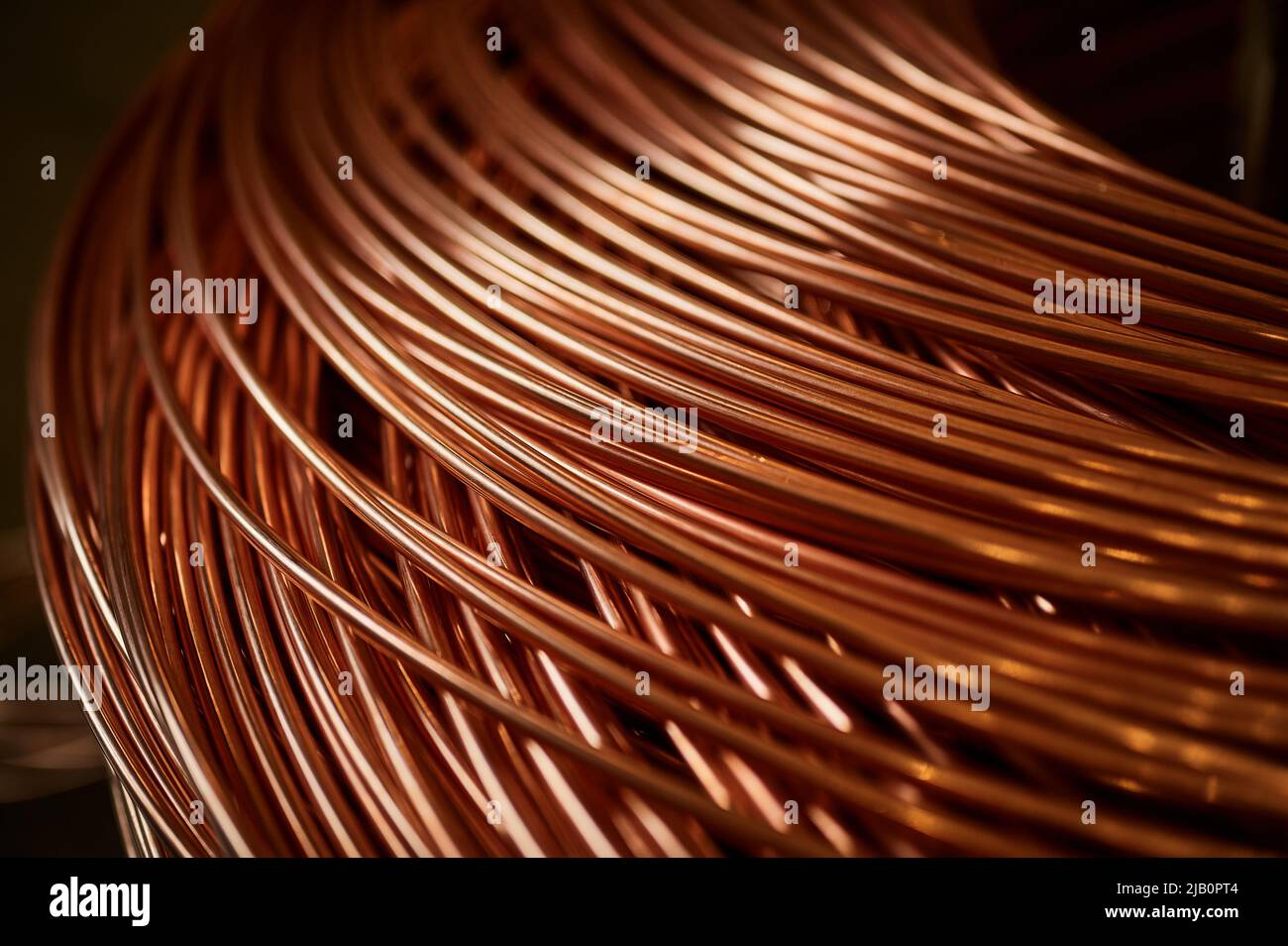 Large bobbin of orange copper wire in light warehouse Stock Photo - Alamy