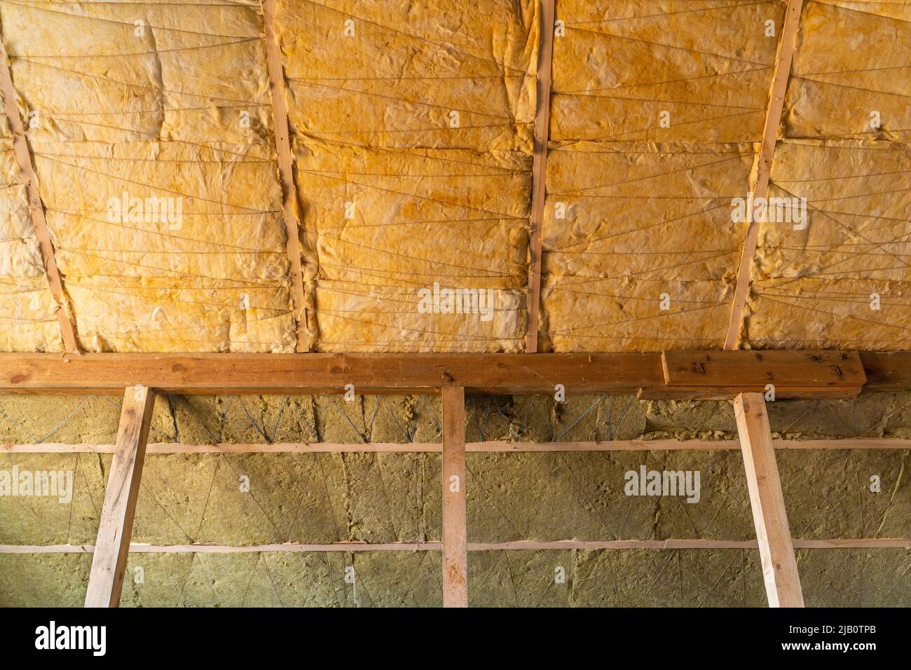 Comparison of mineral and glass wool in one frame. Roof insulation ...