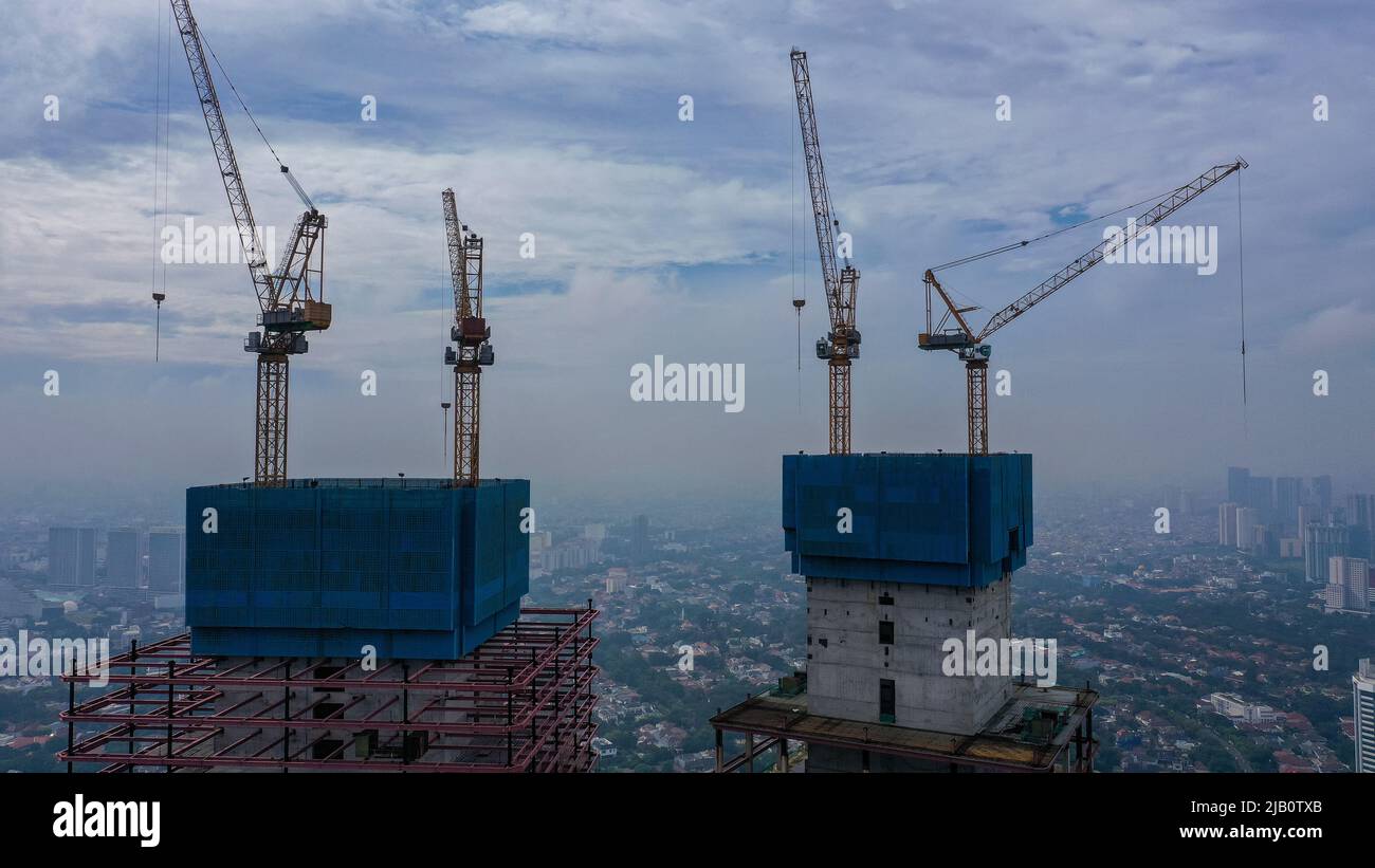 Construction site with cranes. Construction workers are building.Aerial ...