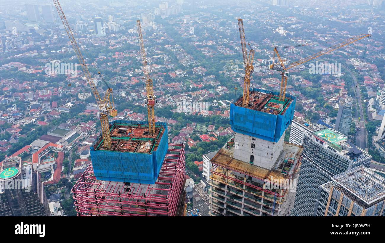 Aerial view of construction crane at building site. Industrial concept ...