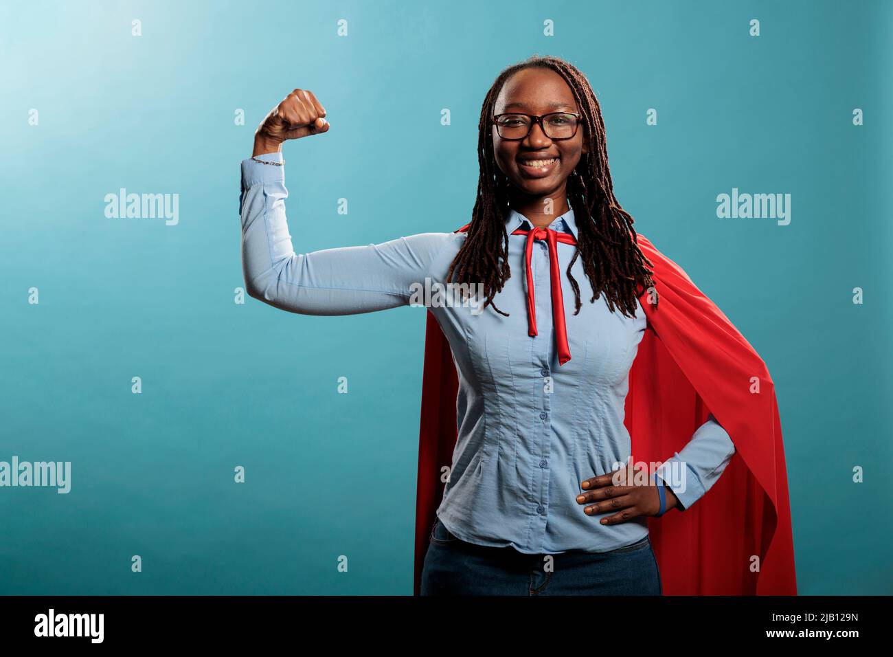 Arms muscle flexing brave superhero woman posing strong and tough for ...