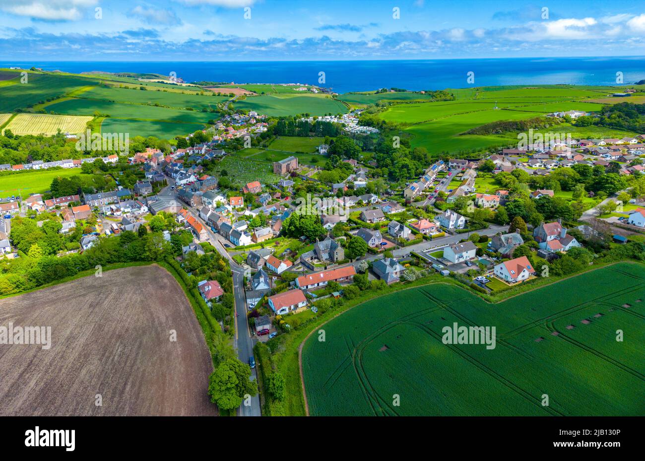 Aerial view from drone of village of Coldingham in Berwickshire ...