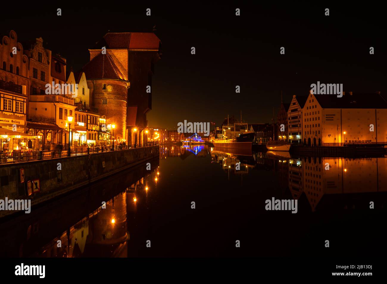 Old town in Gdansk at night. The riverside on Granary Island reflection ...
