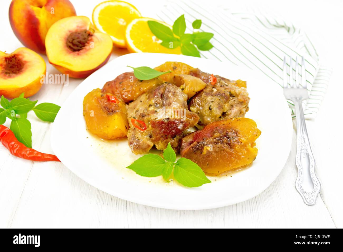 Turkey stewed with peaches, fresh hot pepper and orange sauce, basil ...