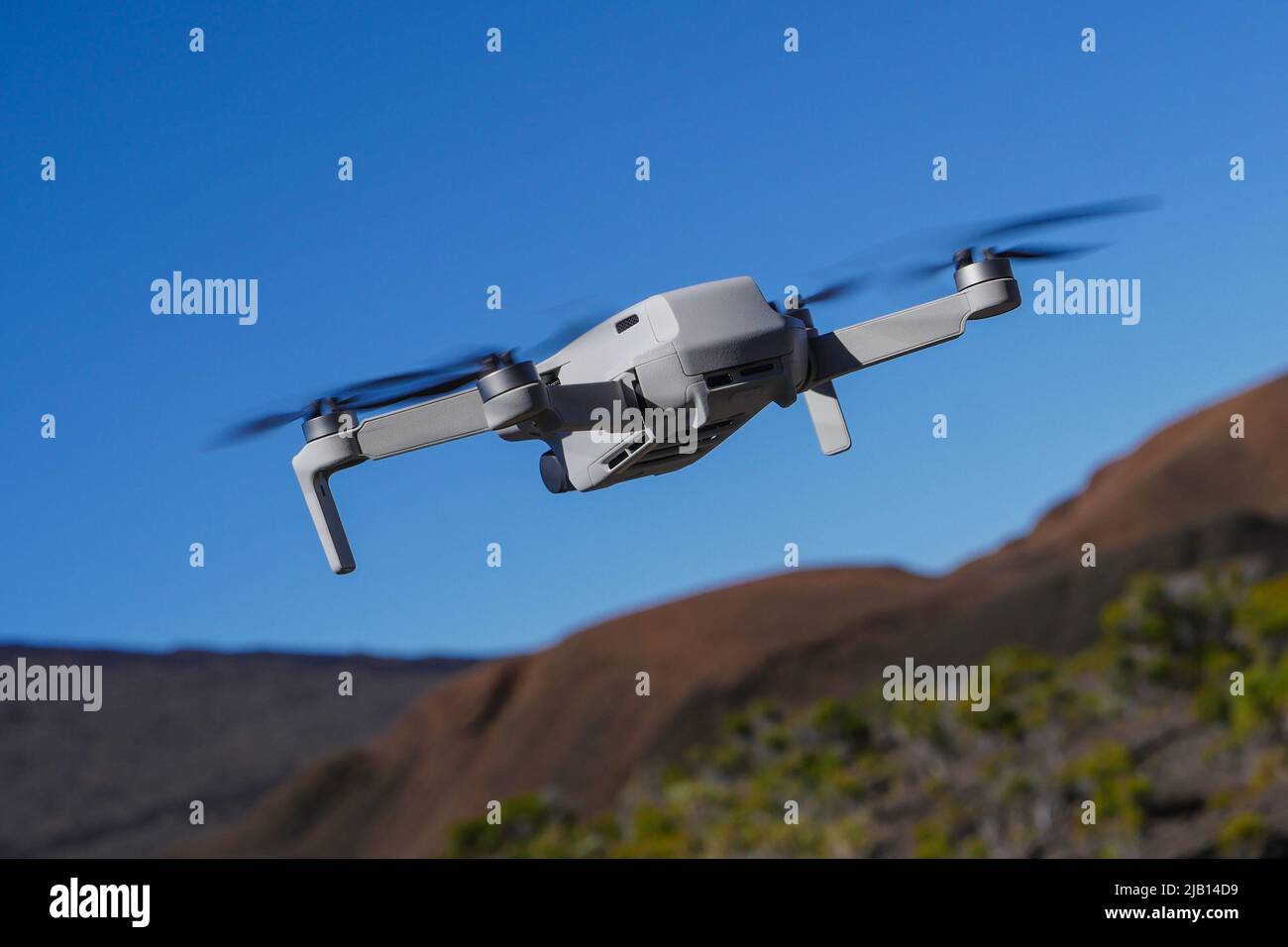 Drone protection flying during the day in volcano mountains Stock Photo ...