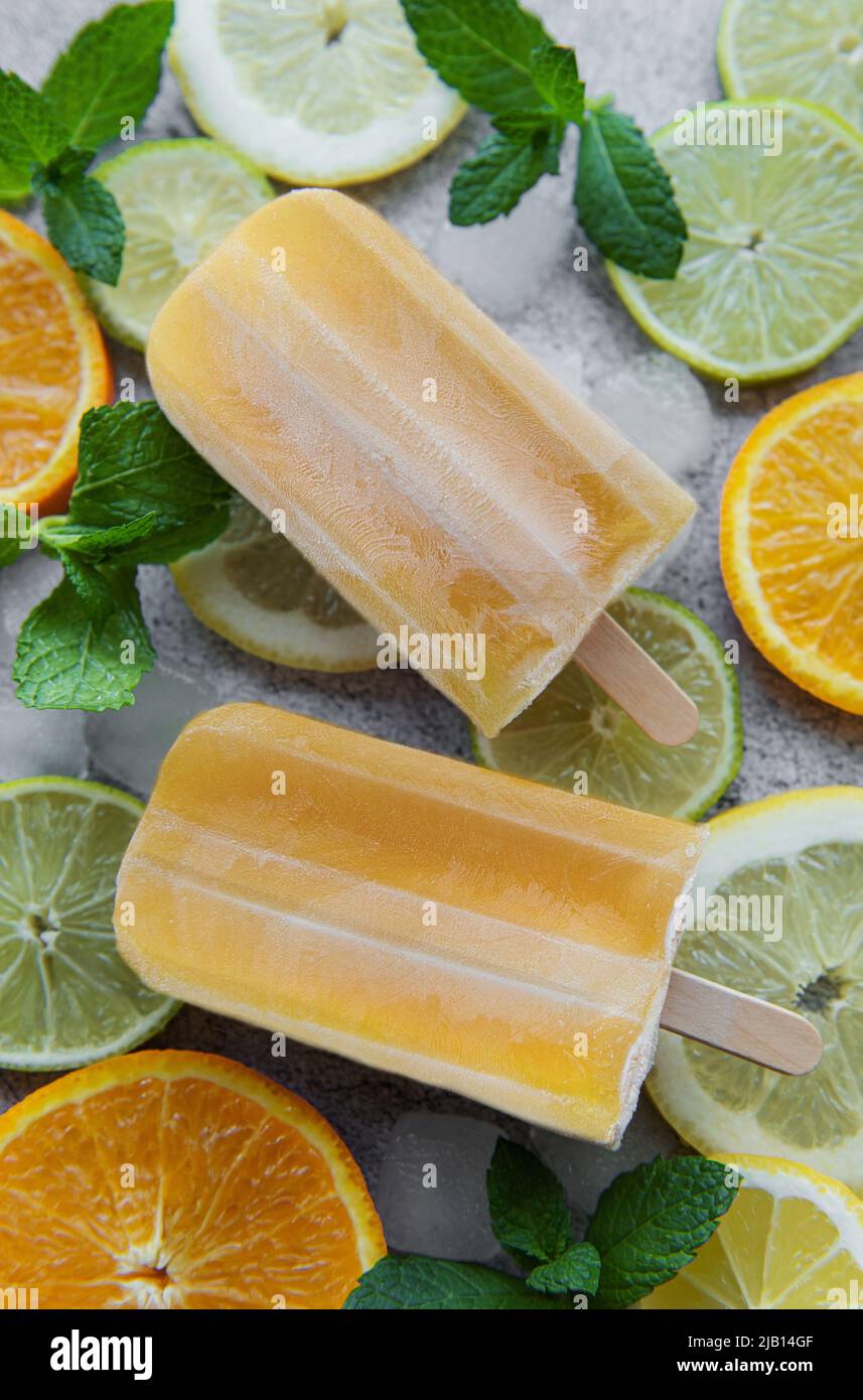 Fruit orange ice popsicle, ice cubes and slices of citrus fruits Stock ...