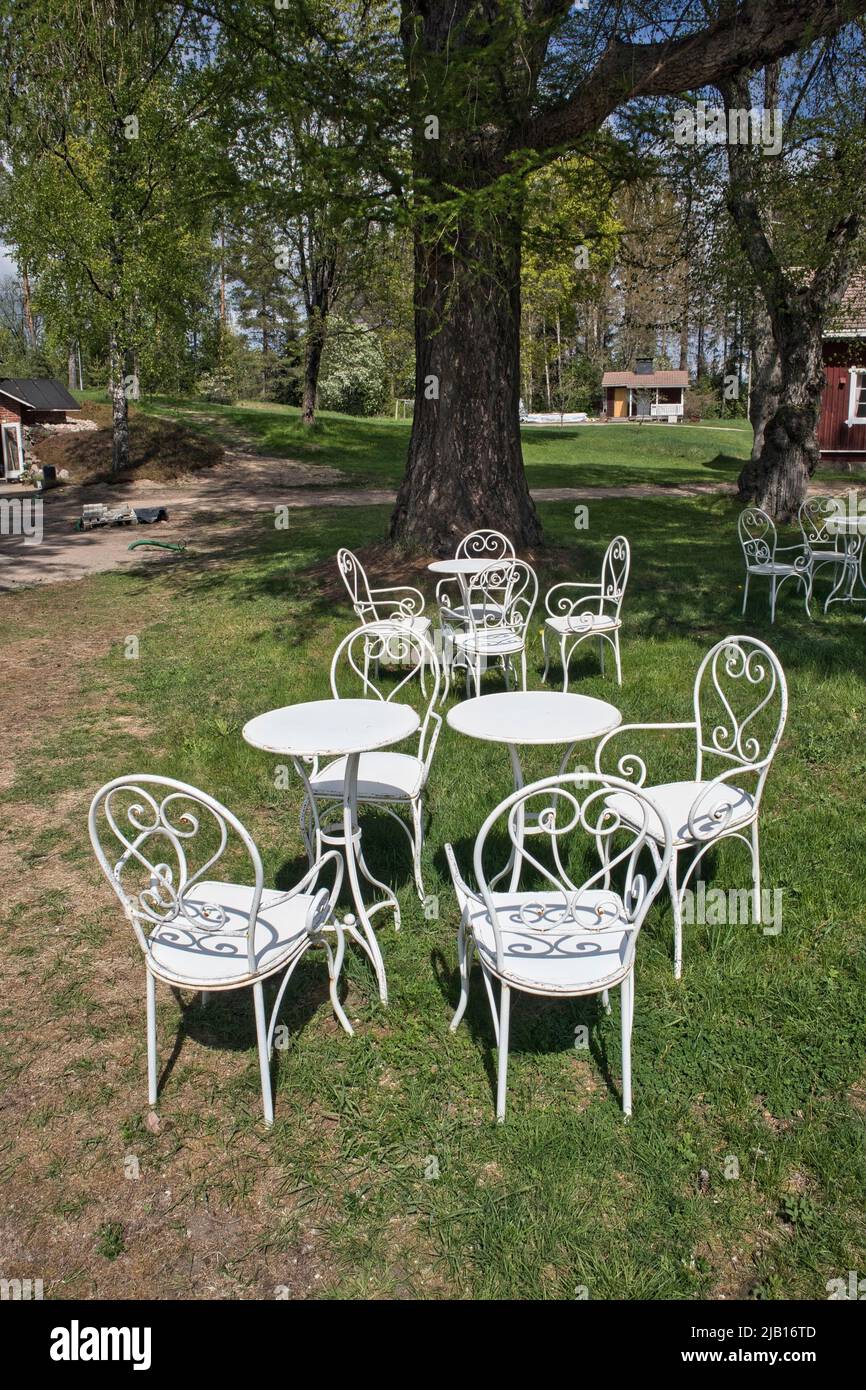 Outdoor restaurant background, metal white chairs and tables Stock ...