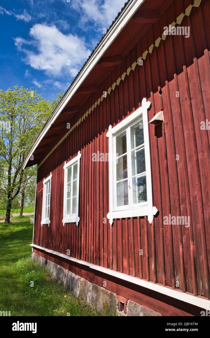 white windows in old red wooden house wall, Finland Stock Photo - Alamy