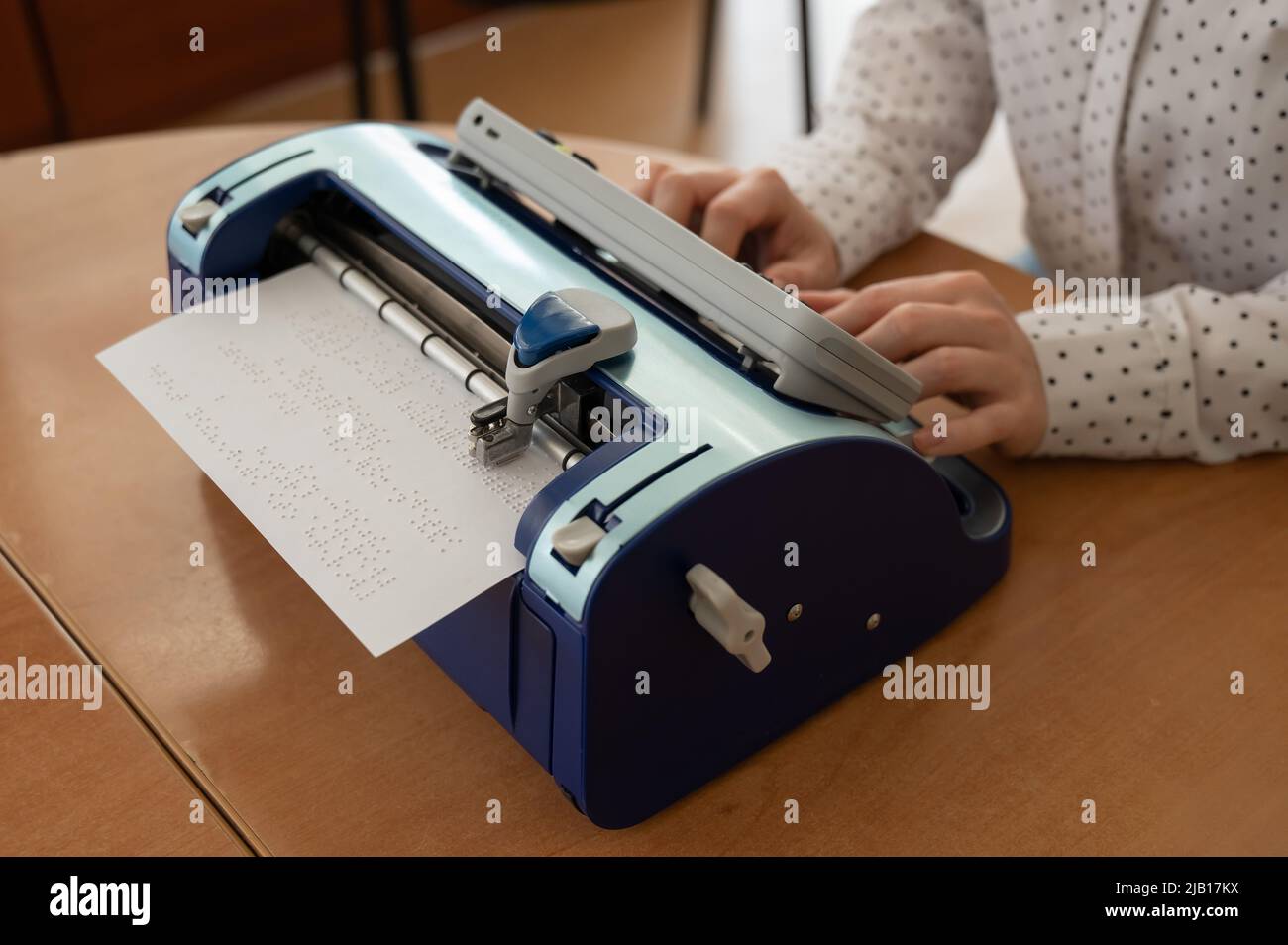 Blind woman using braille typewriter Stock Photo - Alamy