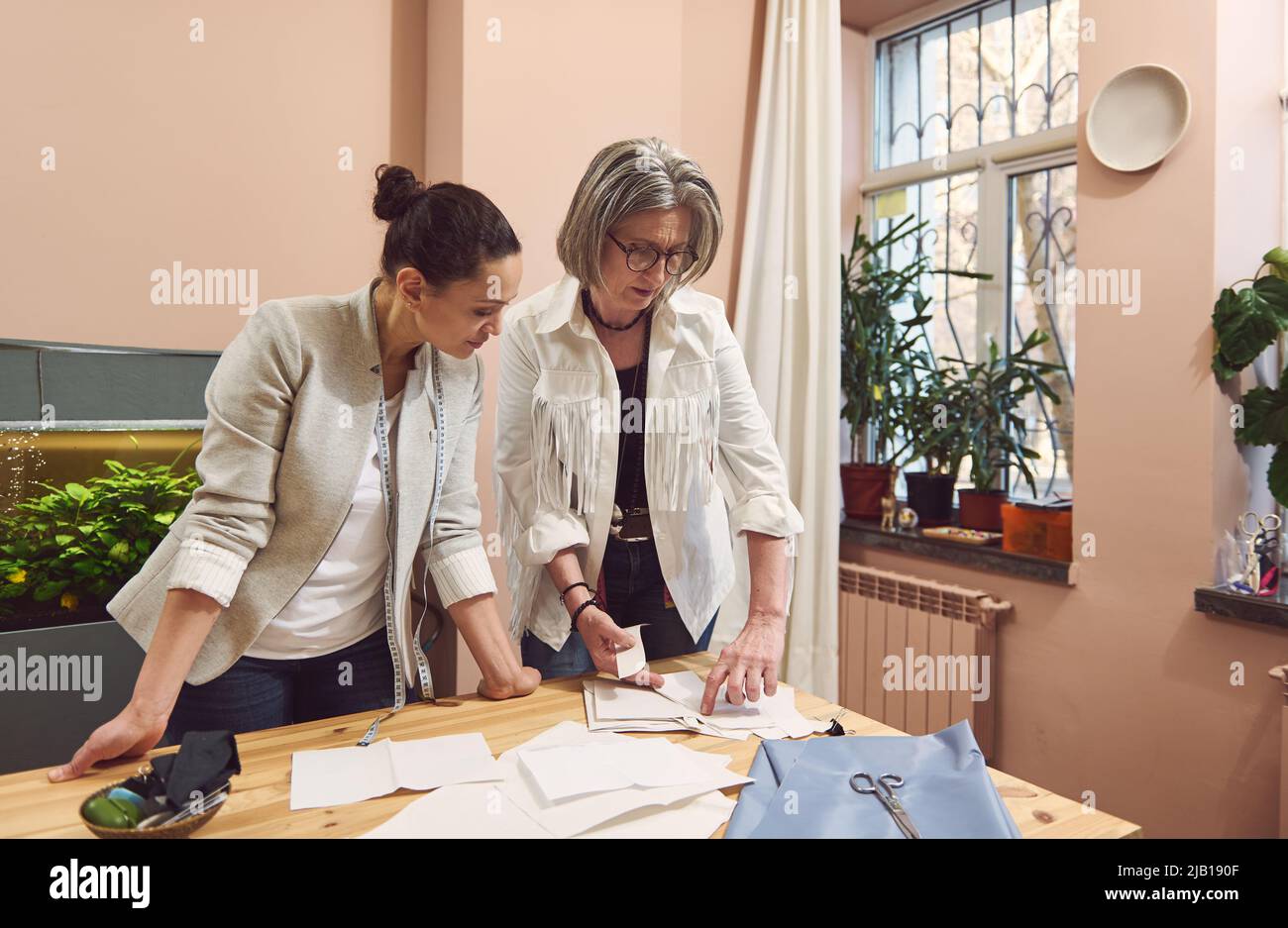 Sewing process, creating a new seasonal collection of handmade clothes ...