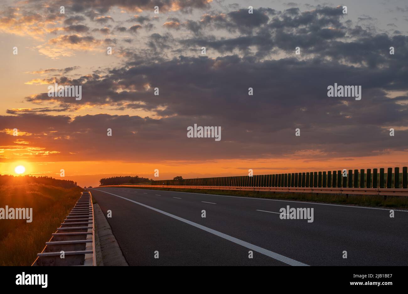 empty highway during a spectacular sunset Stock Photo - Alamy