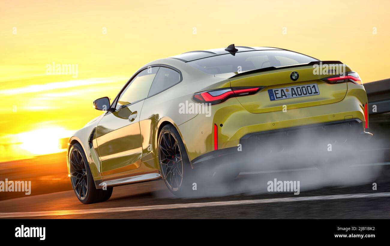 The BMW M4 Competition during a high-speed run on a winding racetrack ...