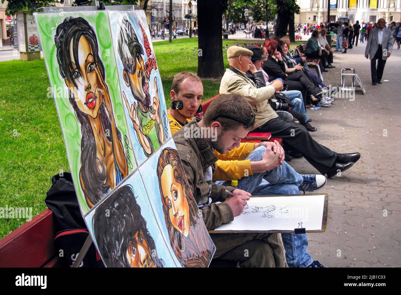 Ukrainian portrait artist working in park, Lviv city centre, Ukraine ...