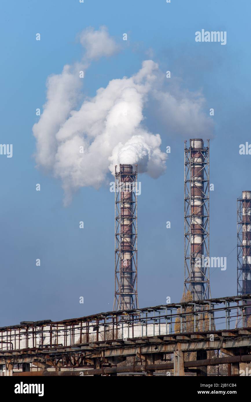 Smoke stack of coal power plant on blue sky background Stock Photo - Alamy