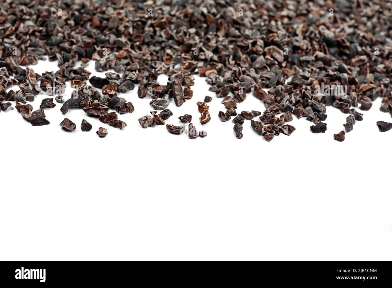 Cocoa nibs, a pieces of broken cocoa beans isolated Stock Photo - Alamy