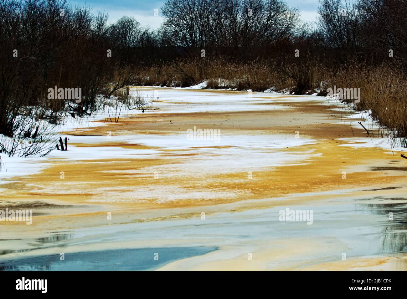 Northern forest and swamp river. The beginning of ice melting in early ...